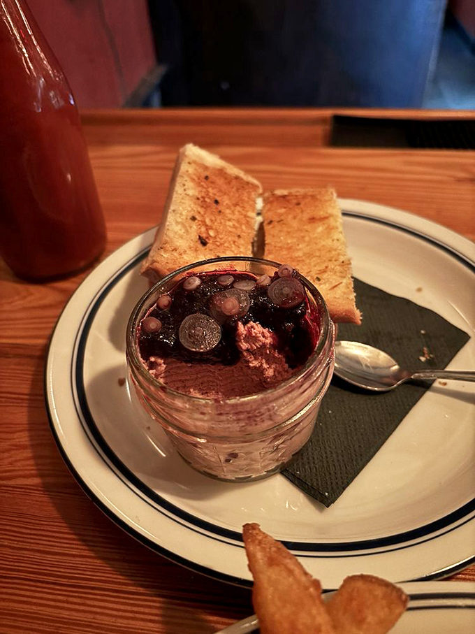 Chicken liver p&acirc;t&eacute; dressed up with berries, proving that even humble ingredients deserve their red-carpet moment.