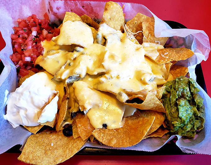 These loaded nachos aren't just a snack&mdash;they're an architectural marvel of cheese, chips, and happiness that demands to be shared.