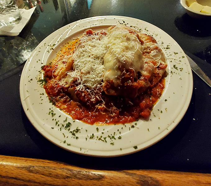 Chicken Parmesan that could unite warring nations &ndash; a mountain of melted cheese and tangy sauce that renders conversation unnecessary.