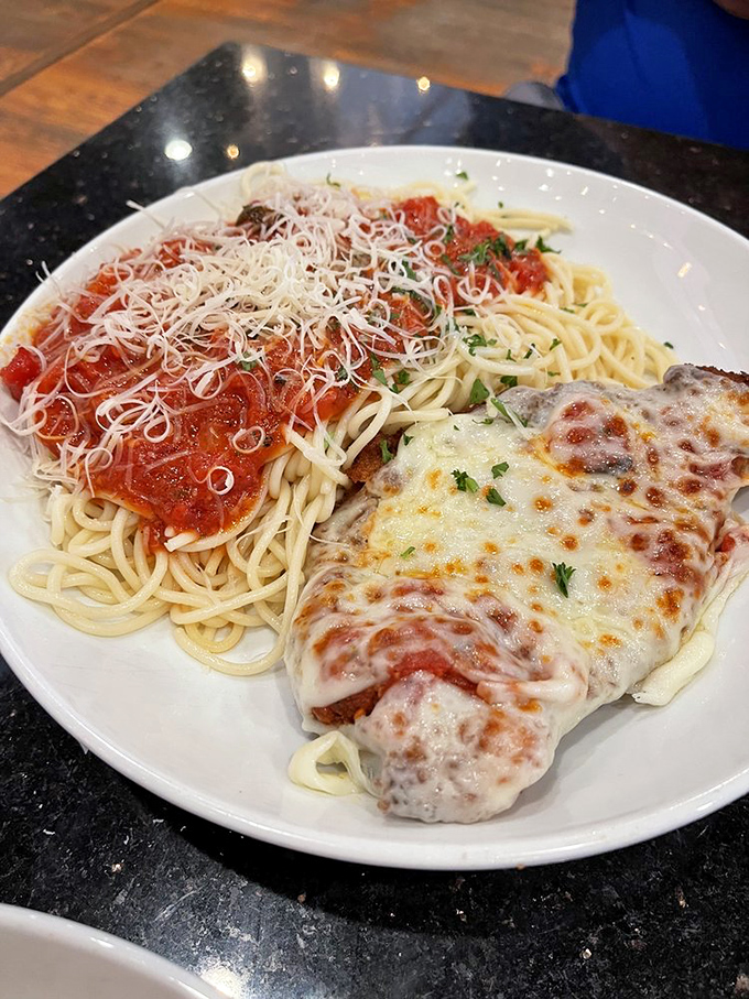 Penne pasta embracing shrimp and spinach in a creamy sauce&mdash;like a culinary group hug on a plate. 