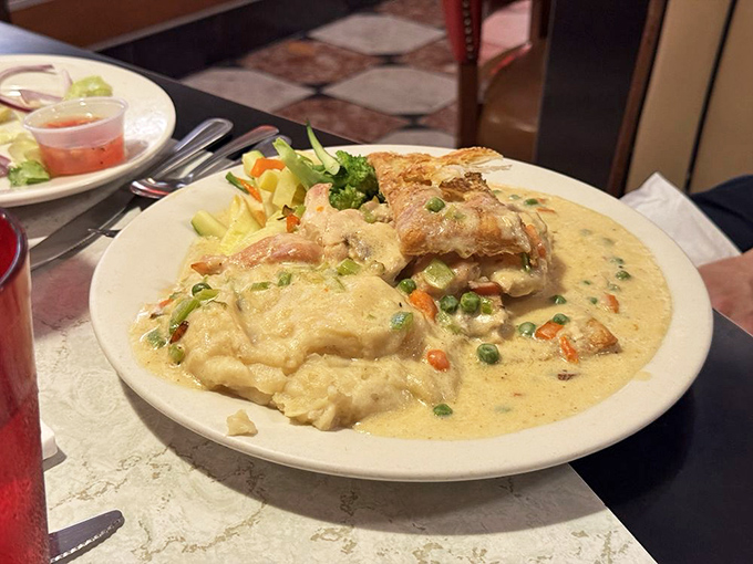 Chicken pot pie swimming in gravy so rich, your cardiologist would write it a strongly worded letter.