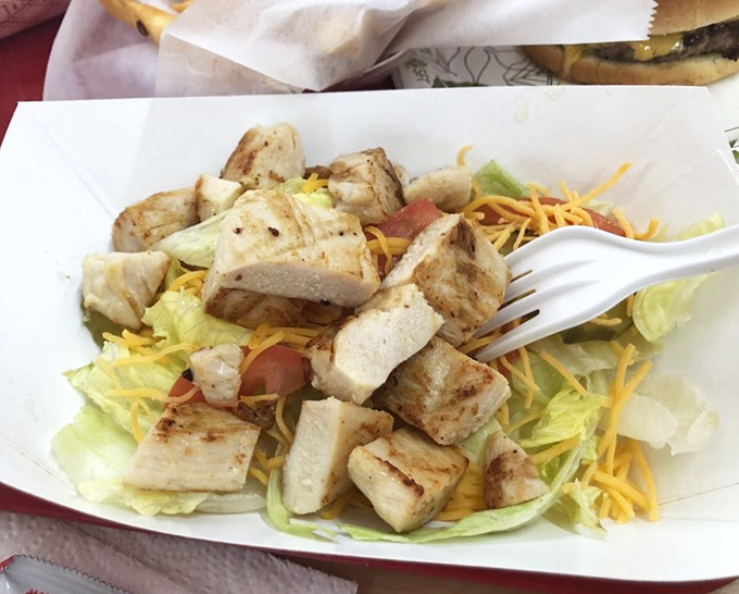 Grilled chicken salad: where "eating light" and "eating right" find delicious middle ground. A protein-packed option for those saving room for milkshakes later.
