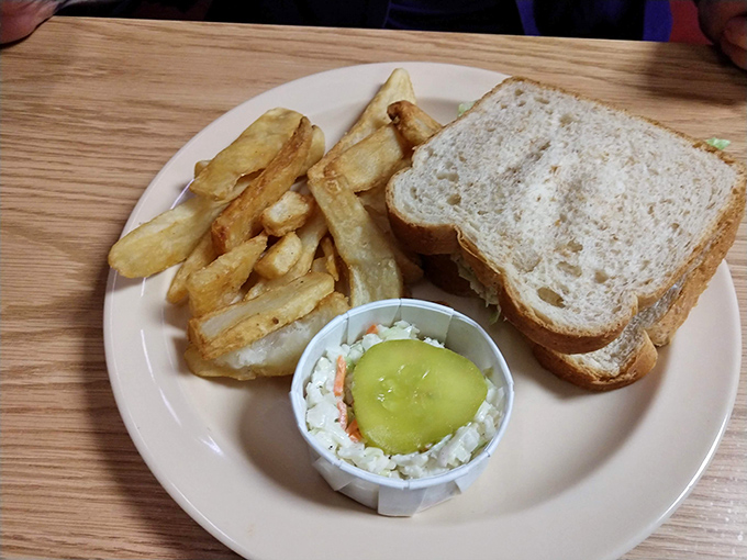 The humble sandwich elevated to art form. Golden fries, creamy chicken salad, and that pickle crown&mdash;lunch royalty that doesn't need a fancy throne.