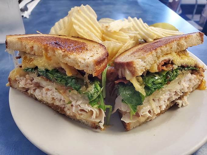 The architectural marvel of this sandwich &ndash; perfectly toasted bread, layers of chicken, cheese, and greens &ndash; would make Frank Lloyd Wright weep with joy.