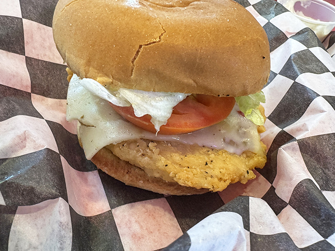Golden fried chicken nestled in a bun with all the fixings &ndash; sometimes poultry deserves the spotlight too, you know.