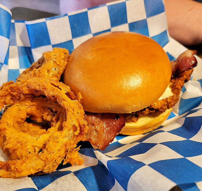 Stacked higher than your weekend reading pile, this chicken sandwich demands a strategy before the first magnificent bite.