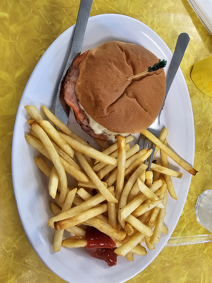 The classic American hamburger and fries&mdash;proof that some traditions don't need reinvention, just proper execution and a healthy dose of ketchup.