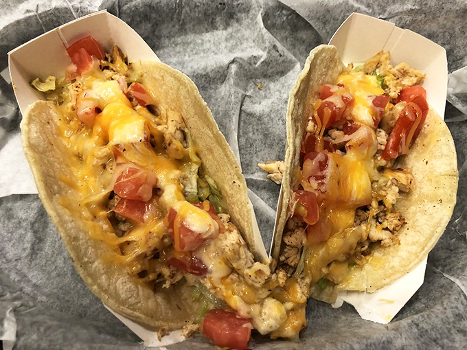 These chicken tacos aren't just wearing cheese&mdash;they're draped in it like they're walking the red carpet of flavor town.