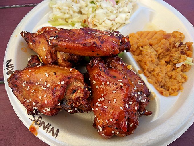 Wings that wear their sauce like a badge of honor. The sesame seed garnish isn't just pretty&mdash;it adds that subtle nutty note that keeps you coming back for "just one more." 