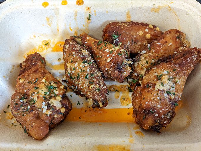 These wings aren't just cooked&mdash;they're transformed. That glistening garlic parmesan coating isn't a condiment; it's a philosophy of flavor.