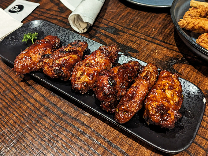 Wood-fired wings with a lacquered glaze that would make furniture makers jealous &ndash; these aren't your average sports bar chicken appendages.