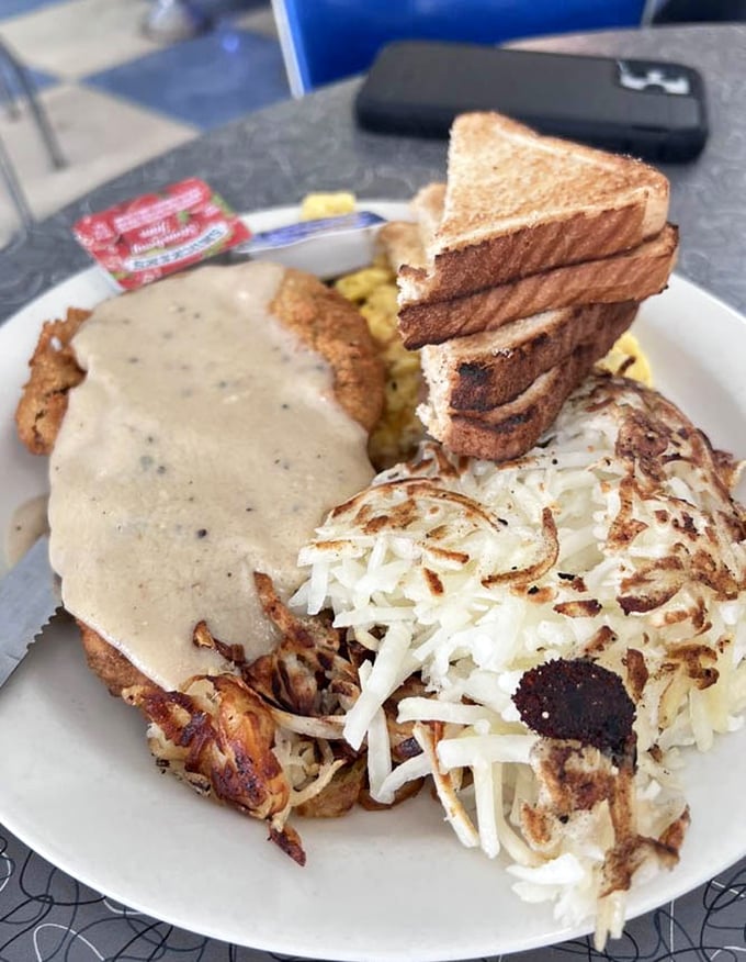 Chicken fried steak that achieves the impossible trifecta: crispy exterior, tender interior, and gravy that could solve world conflicts.