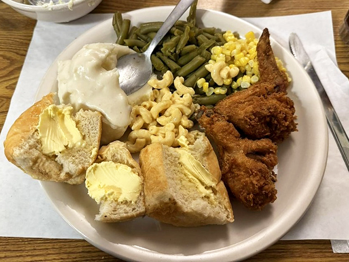 The complete Monte Ne experience on one plate: crispy chicken, buttery corn, green beans, mashed potatoes, and bread that's begging for apple butter.