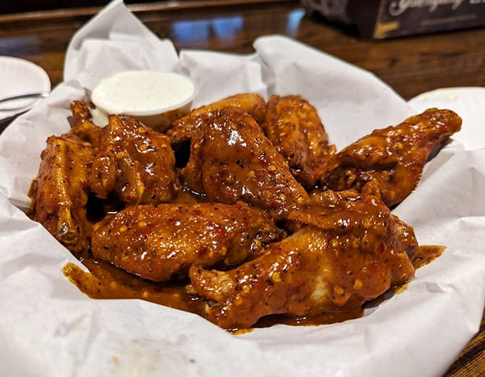 Wings so glossy they could be in a food magazine photoshoot. That sauce looks sticky enough to require an extra stack of napkins.