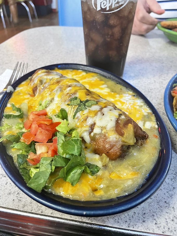 Green chile relleno swimming in cheese proves New Mexico knows exactly what breakfast should look like every morning.