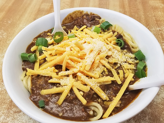 Comfort in a bowl: Carl's hearty chili topped with shredded cheese and green onions&mdash;proof that sometimes the side attraction steals the show.