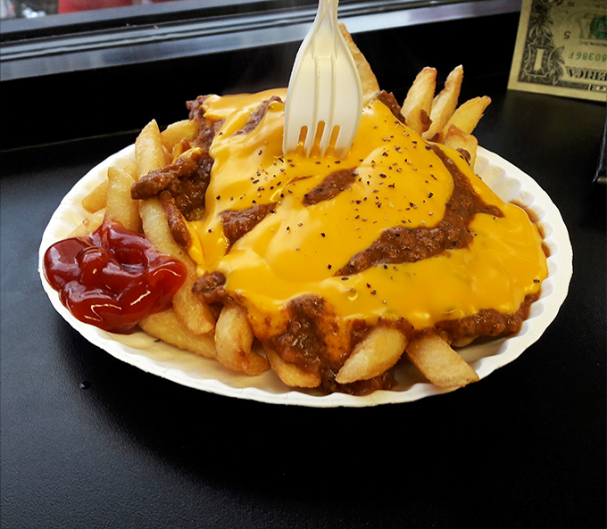 French fries crowned with chili and melted cheese transform humble potatoes into comfort food royalty.