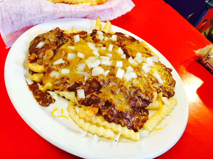 Chili cheese fries that look like they were assembled by someone who truly understands the meaning of indulgence.