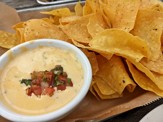 Queso with pico de gallo and tortilla chips &ndash; because sometimes you need a brief intermission between acts of meat consumption.