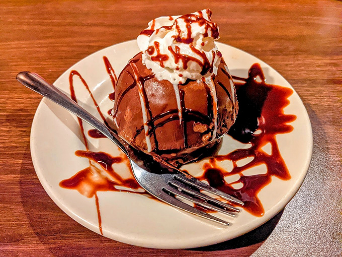 This chocolate dome isn't just dessert&mdash;it's architecture with a sweet soul and a whipped cream hat.