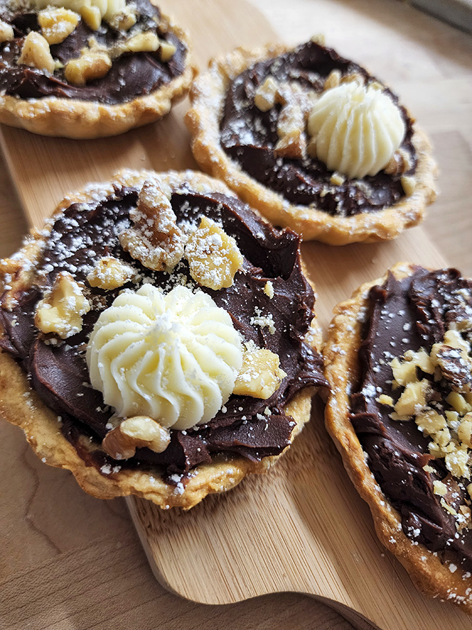 Chocolate tarts with butter-cream rosettes&mdash;because sometimes breakfast should feel like you're getting away with having dessert before noon.
