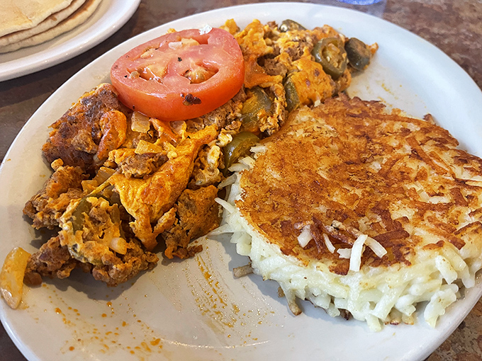 This isn't just breakfast, it's edible architecture – where eggs and chorizo create a savory skyscraper that would make Frank Lloyd Wright reach for hot sauce.