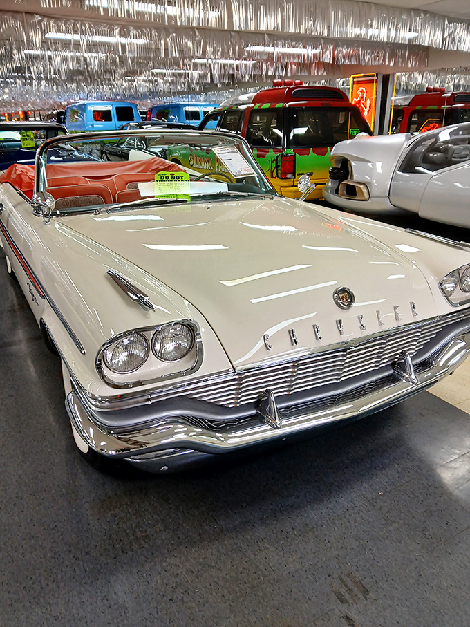 This pristine Chrysler convertible represents the pinnacle of 1950s automotive elegance. Chrome for days and styling that still turns heads.