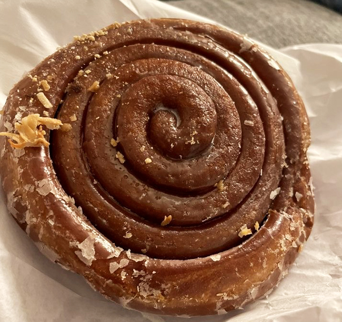 The perfect spiral of this cinnamon roll promises layers of flavor that unfold with each bite. Geometry has never been so delicious.