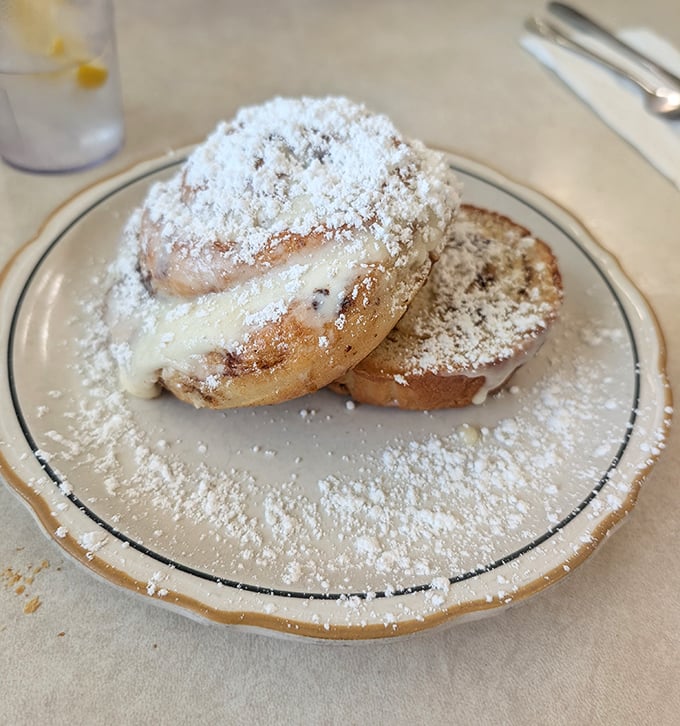 The grilled cinnamon roll isn't just breakfast&mdash;it's dessert masquerading as a morning meal, complete with cream cheese frosting.