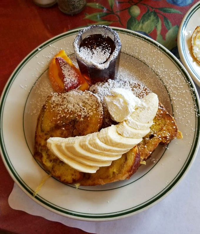 Banana French toast with a fan of fresh fruit&mdash;proof that someone in that kitchen understands the architecture of breakfast joy.