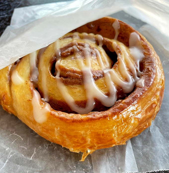 Golden, flaky, and glistening with icing &ndash; this cinnamon roll isn't just breakfast, it's a legitimate reason to get out of bed.