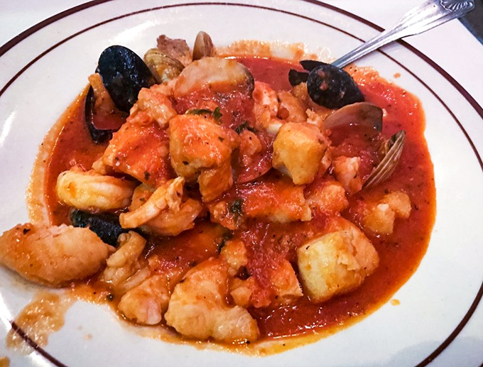 Cioppino so authentic you'll check your passport&mdash;a tomato-based seafood symphony where each bite delivers the essence of coastal Italian cooking.