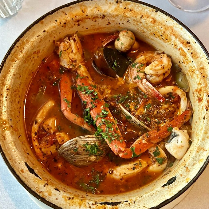 This cioppino isn't just soup—it's a seafood treasure hunt where every spoonful reveals a new oceanic prize in rich, aromatic broth.