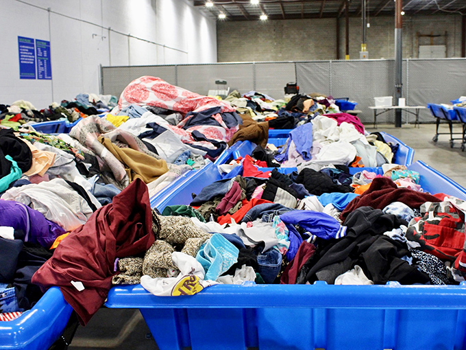 Textile mountain ranges waiting to be conquered. Somewhere in this colorful landscape lurks the perfect vintage sweater or designer find.