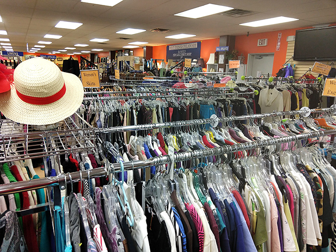 Rack after colorful rack stretches into the distance, a fashion treasure hunt where that perfect summer hat might just be waiting for its next adventure.