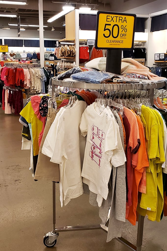 The "Extra 50% Off" sign &ndash; three words that can make grown adults skip with joy through clothing racks.