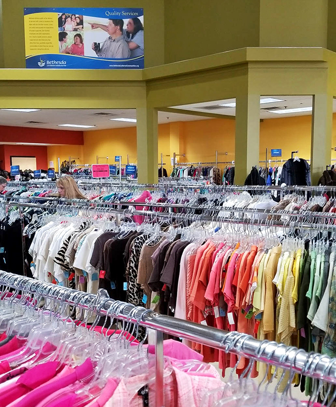 Rainbow-organized clothing racks make finding that perfect blouse as easy as following Roy G. Biv through a fashionable treasure hunt.