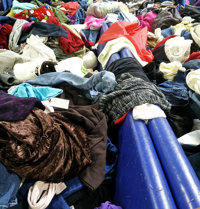 The textile treasure hunt in full swing. Somewhere in this colorful chaos lurks a designer piece that costs less than your morning latte.