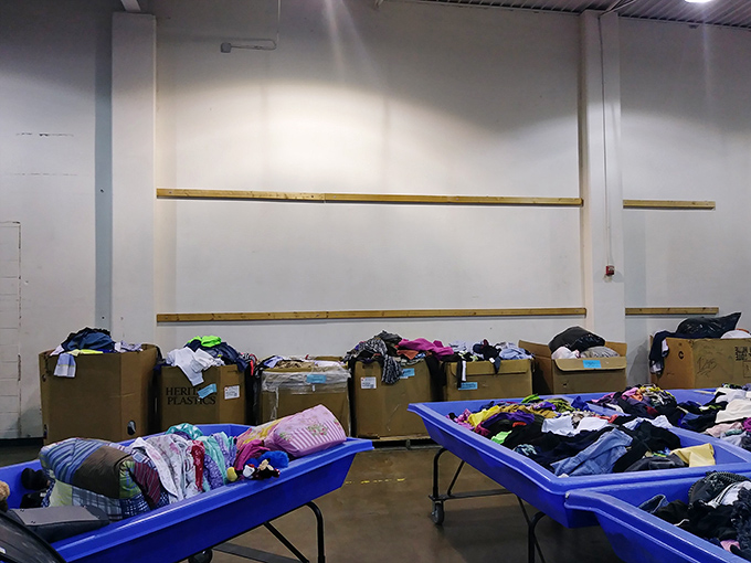 The calm before the storm. Fresh bins await the next rotation when shoppers will descend like polite vultures on fashion carrion.