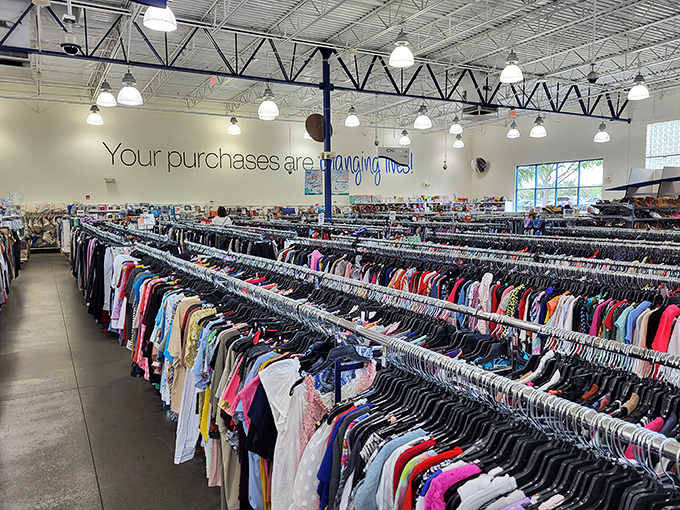 The clothing section stretches toward infinity, a textile galaxy where yesterday's fashion finds tomorrow's appreciative owner.