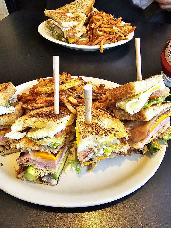 Club sandwiches stacked higher than a Dallas skyscraper, with sweet potato fries that could make a vegetable-avoider reconsider their life choices.