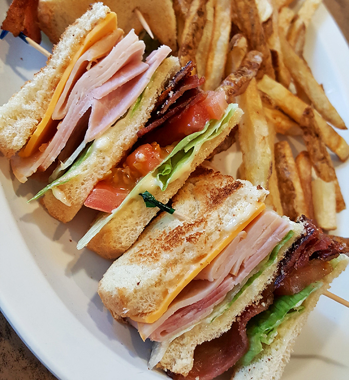 The architectural marvel of sandwiches! This perfectly constructed club stands taller and prouder than most downtown skyscrapers.