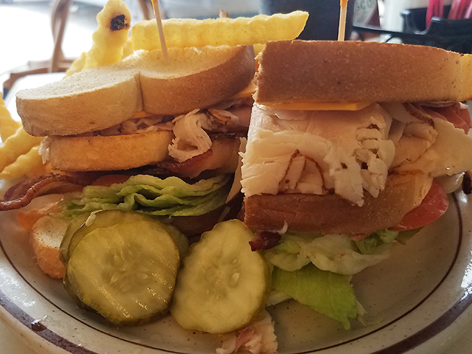 Not just a sandwich, but a skyscraper of layers&mdash;crisp lettuce, juicy tomato, and tender meat between the supportive scaffolding of toasted bread.