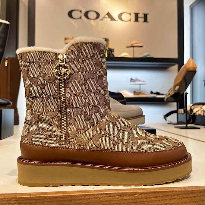 Winter boots that whisper "yes, I'm practical" while simultaneously shouting "but look how fabulous I am!" Classic Coach contradiction.