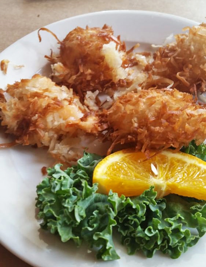 Coconut shrimp that strike the perfect balance between crispy exterior and tender interior. The tropical coating plays beautifully with the sweet seafood.