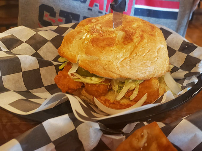 A sandwich that requires both hands and your full attention&mdash;crispy fish nestled in a pillowy bun that's worth every delicious, messy bite.