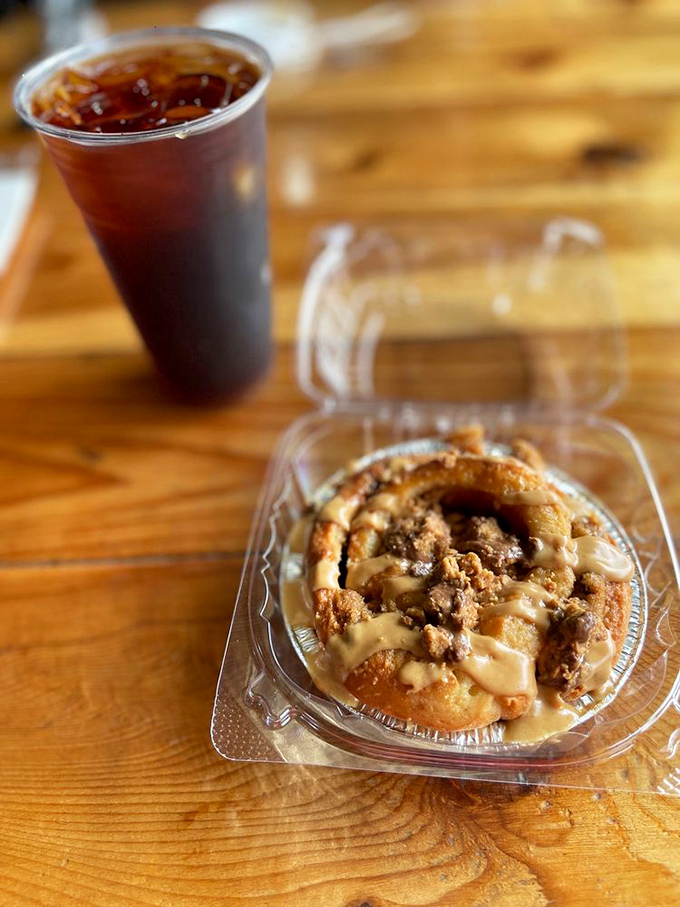 Sweet meets caffeinated: a mason jar of cold brew stands guard beside what might be the most tempting cinnamon roll in central Florida.
