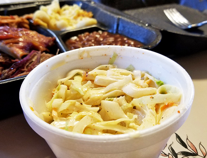 Coleslaw that knows its supporting role but steals scenes anyway. The perfect cool, crisp counterpoint to smoky meat—like Astaire to Rogers.