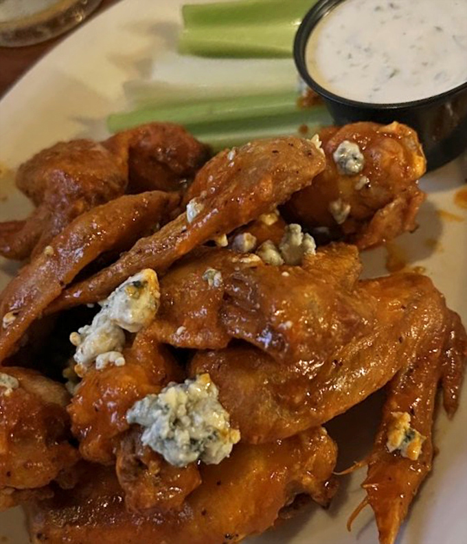 Buffalo wings that make you question why anyone would eat them any other way. Blue cheese crumbles add that perfect sharp contrast.