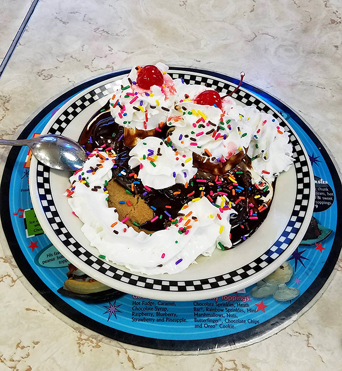 A sundae that requires a game plan before eating. With sprinkles, whipped cream, and cherries, it's what childhood dreams are made of.